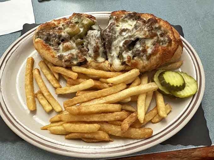 A Philly cheesesteak overflowing with meat and cheese alongside crispy fries delivers serious lunchtime satisfaction every single time.