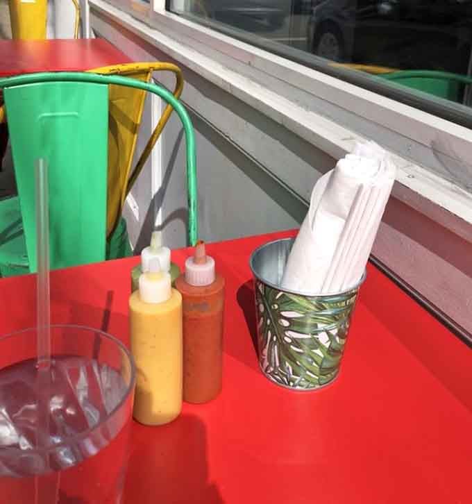 Squeeze bottles of homemade sauces stand ready like condiment superheroes, waiting to elevate your already excellent meal to legendary status.