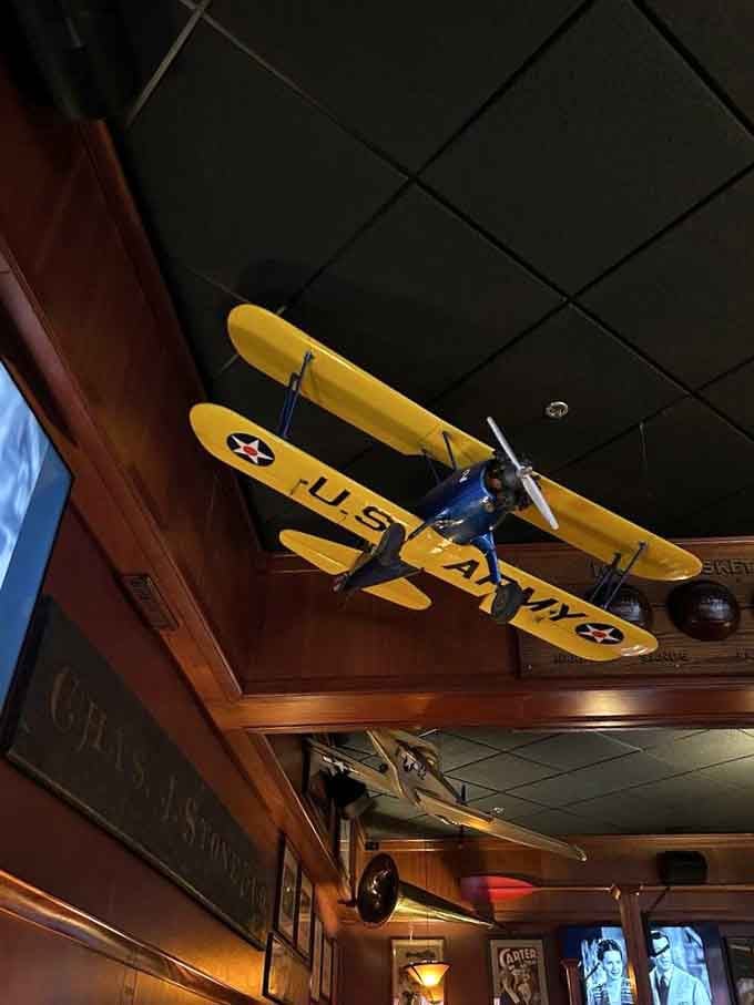 A vintage biplane suspended from the ceiling adds whimsy to your burger experience, as nature intended.