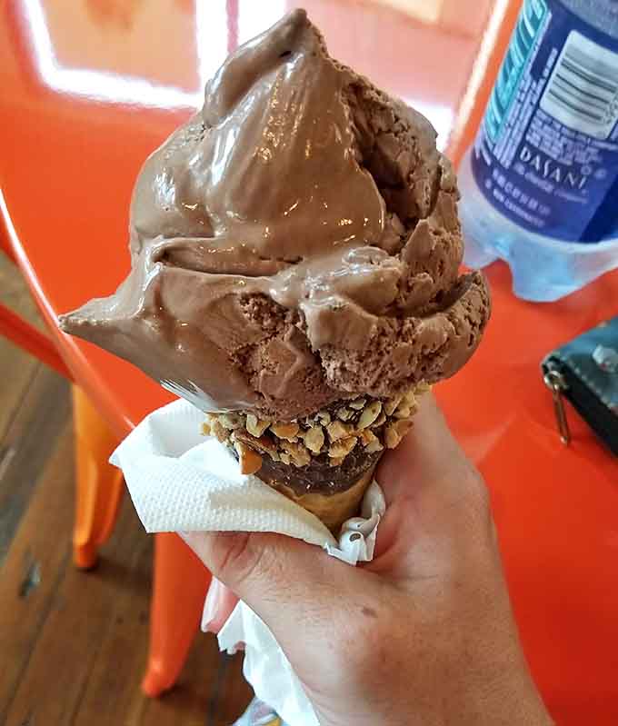 This cone means business with its chocolate-dipped, nut-covered base supporting a generous scoop that defies gravity and common sense in the best way.