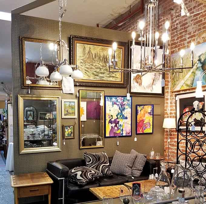 Vintage chandeliers and maritime art create an atmosphere fancier than most people's actual dining rooms.