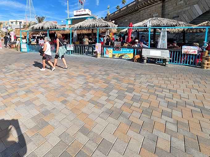 Thatched roofs and tiki bars coexist peacefully, creating the world's most geographically confused yet charming waterfront.