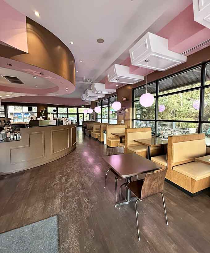 Booth seating with pink accents and globe lights, creating the kind of atmosphere where calories definitely don't count.