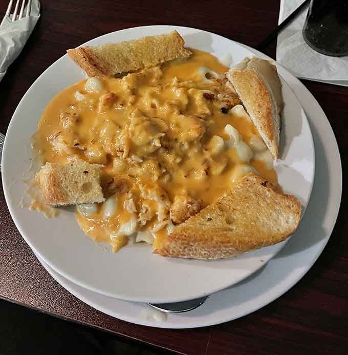 Lobster Mac and Cheese that's basically comfort food wearing a tuxedo to a beach party, fancy yet casual.