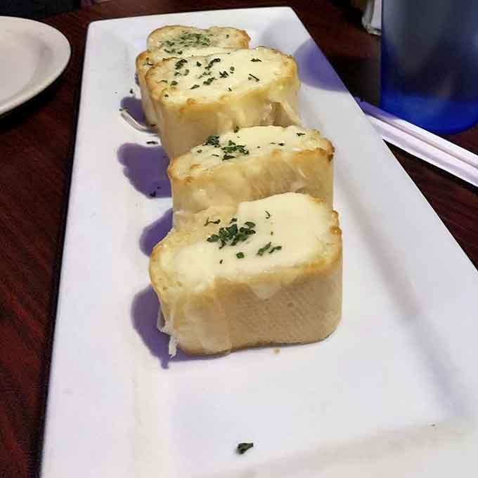 Garlic cheese bones are the perfect appetizer, proving that even the side dishes get the monster treatment here.