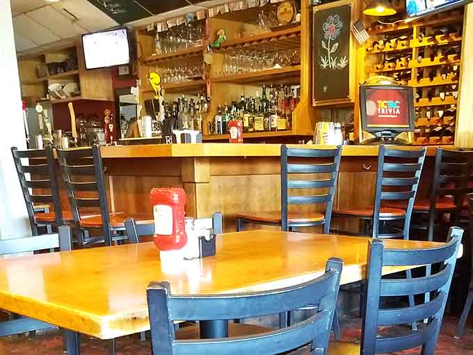 The bar gleams with promise, bottles lined up like soldiers ready to create your perfect evening libation.