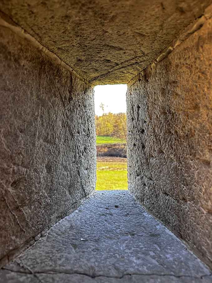 Thick stone walls frame a narrow opening, reminding you that fortress architecture wasn't exactly designed for comfort.