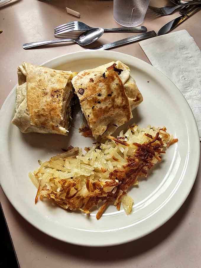 Wrapped burritos alongside perfectly crisped hash browns prove that breakfast doesn't need to be complicated to be completely satisfying.