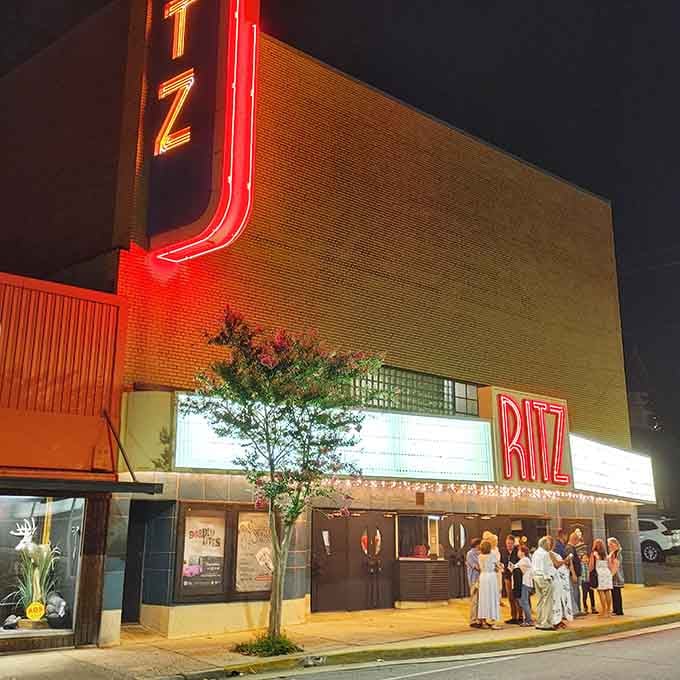 The Ritz Theatre glows with vintage neon charm, reminding you that entertainment existed before streaming services monopolized our evenings completely.