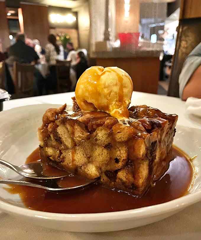 Bread pudding crowned with ice cream and caramel sauce: because sometimes dessert should be completely over the top.