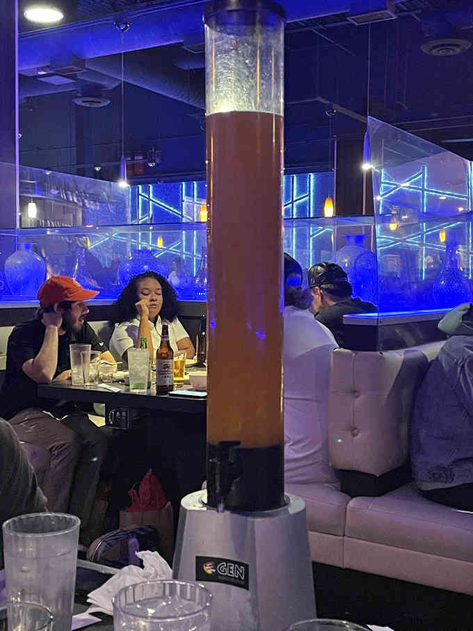 The dining room buzzes with happy grillers, each table its own cooking show without the pressure of TV cameras.