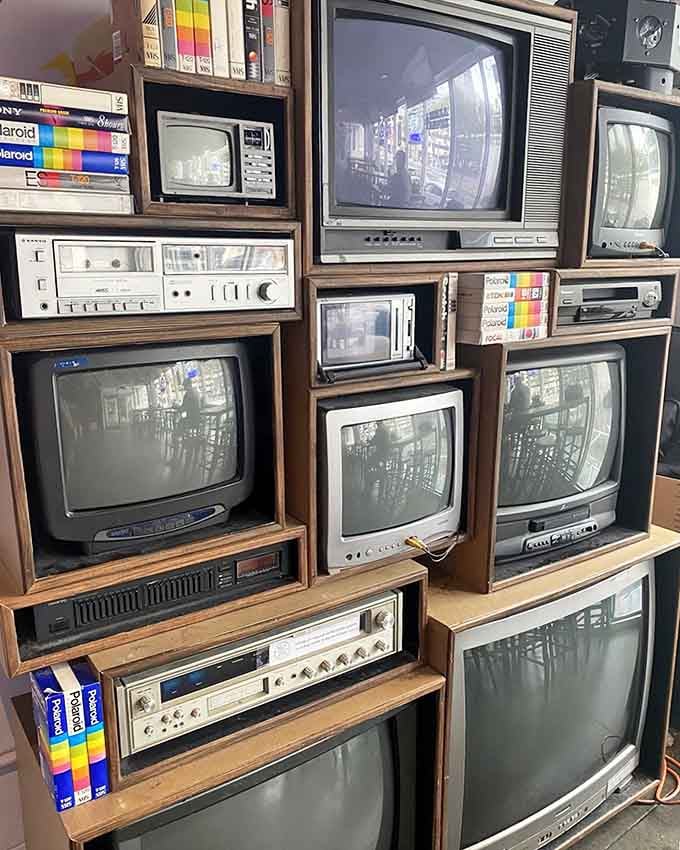 A wall of vintage televisions that once required you to actually get up to change the channel.