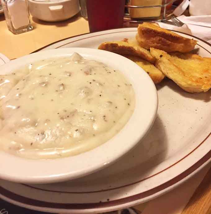 Biscuits drowning in sausage gravy with Texas toast proves carbs are not the enemy, they're the solution.
