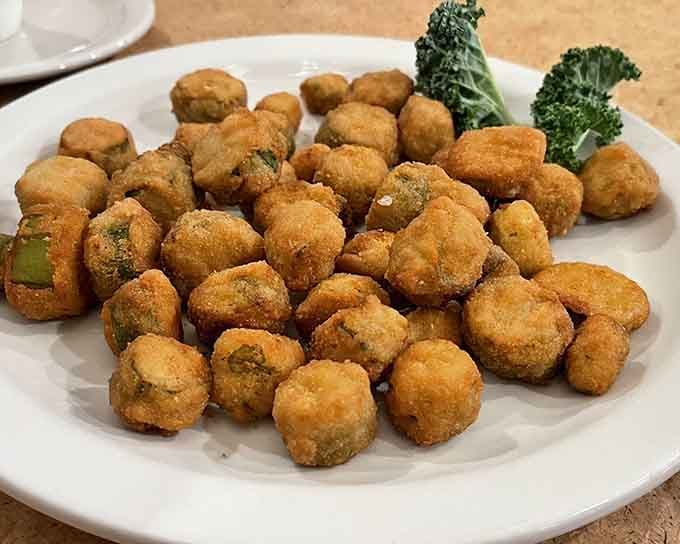 Fried okra arrives in golden battalions, crispy and addictive enough to convert even the most skeptical okra doubters among us.
