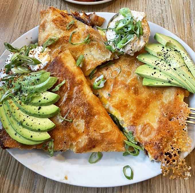 Golden quesadillas stuffed with eggs and avocado slices prove breakfast doesn't have to follow traditional rules to succeed.
