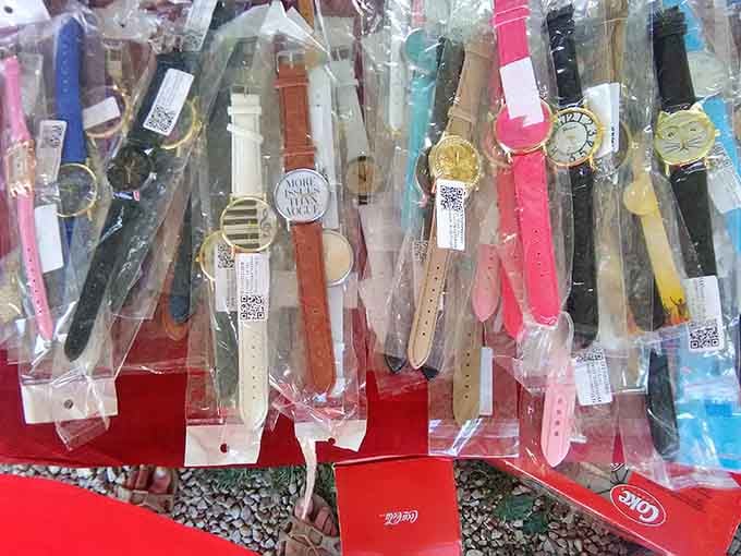 Watches lined up like tiny time machines, each one ready to make punctuality fashionable again at bargain prices.