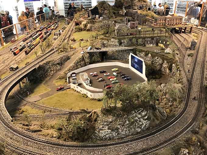 Train enthusiasts built this incredibly detailed miniature world, complete with a drive-in theater that probably shows better movies than most.