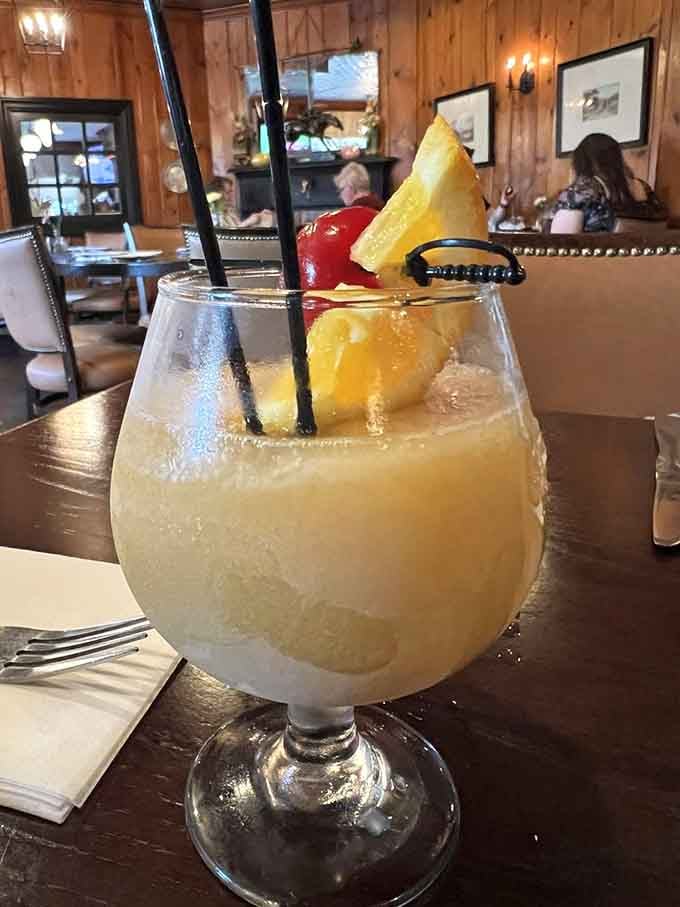 The Bourbon Slush arrives looking like a tropical vacation decided to crash a Kentucky tavern party successfully.