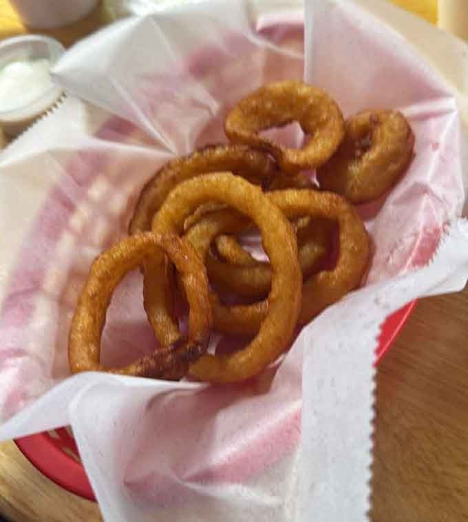 Golden onion rings that crunch louder than your knees when you stand up after eating them.