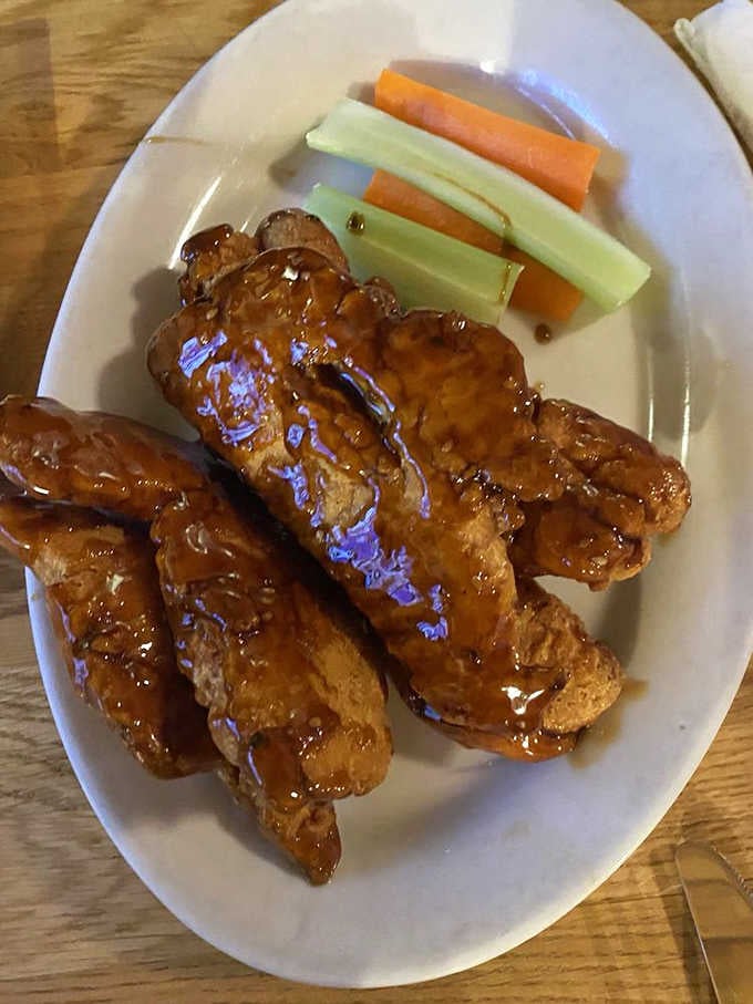 Teriyaki chicken tenders glazed to perfection, glistening like they just won a beauty pageant for comfort food.