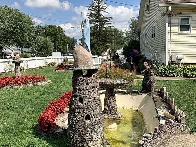 Miniature towers flank a reflecting pool, creating a scene that would make any model train enthusiast weep with jealous admiration.