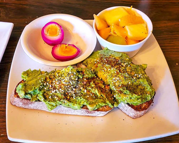 Avocado toast elevated with everything bagel seasoning, pickled eggs, and fresh fruit makes millennial dreams come deliciously true.