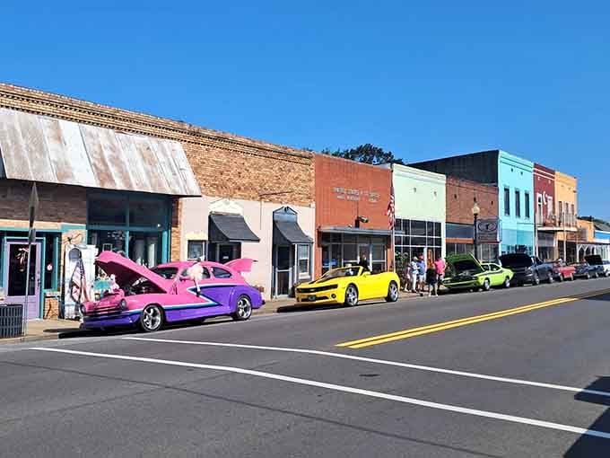 A Model A roadster parks outside antique shops, proving that some things genuinely improve with age and proper care.
