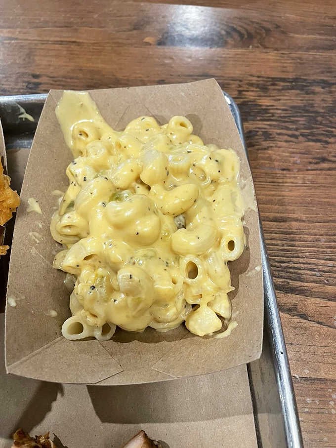 Creamy, cheesy mac and cheese with visible pepper flecks promises comfort in every single bite.