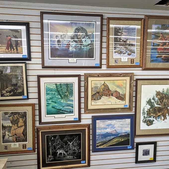 Framed artwork covering the walls like a gallery where every piece costs less than a fancy dinner out.