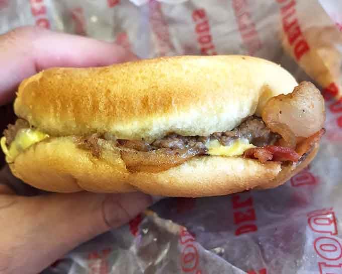 Bacon, egg, cheese, and a perfectly cooked patty on a bun&mdash;breakfast and lunch had a baby, and it's glorious.