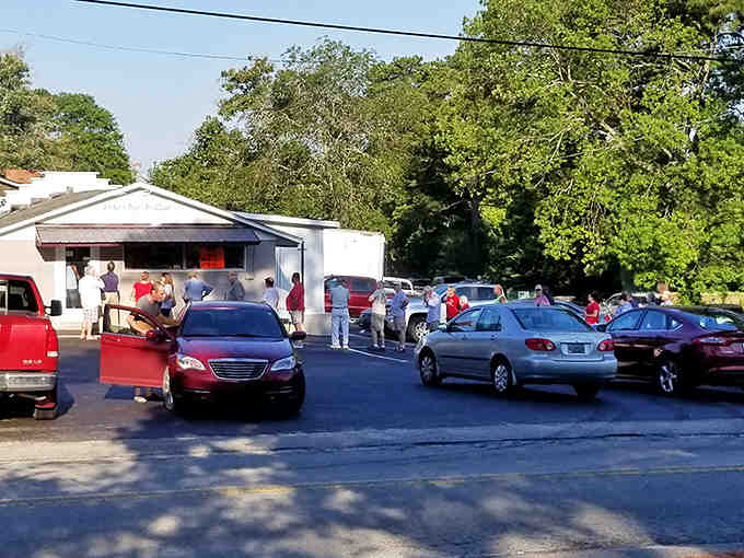 This is what decades of loyal customers looks like: cars lined up like it's opening day at a theme park, except better.
