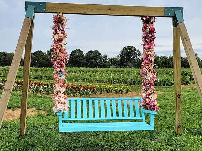 A turquoise swing draped in flowers offers the perfect spot for contemplating life's beauty or just resting your flower-picking feet.