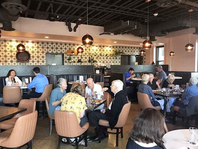 The dining room buzzes with that perfect energy of people genuinely enjoying themselves over good food and conversation.