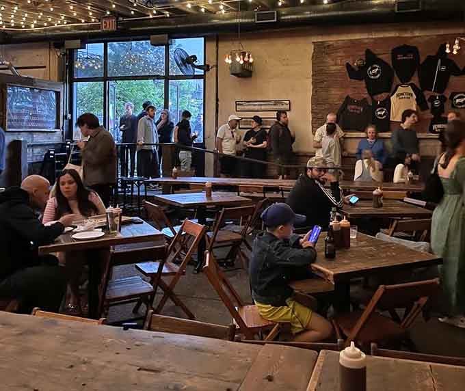 Happy diners fill communal tables in this bustling space where strangers become friends over shared meat platters.