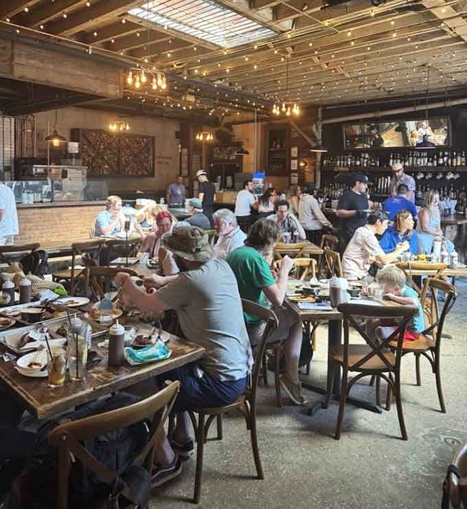 Communal tables filled with happy diners prove that great barbecue creates instant community among total strangers everywhere.