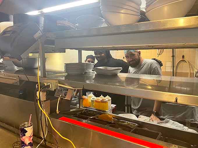 Behind every great meal is a kitchen crew working hard to keep the grouper sandwiches coming and customers smiling.
