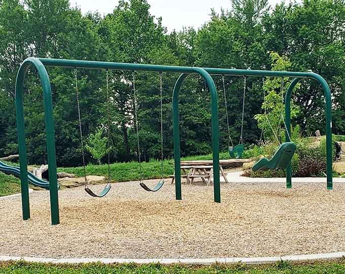 Let the kids burn energy on swings while you contemplate the energy ancient builders expended creating earthworks.