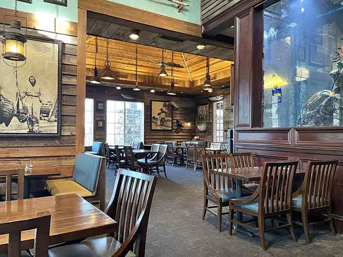 Wood paneling and open ceilings create that fishing lodge vibe where everyone feels like a regular from day one.