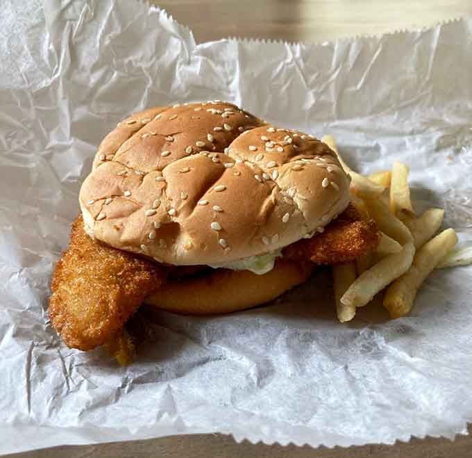 That golden-fried perch sandwich on a sesame bun is Wisconsin lake country meeting classic drive-in perfection.