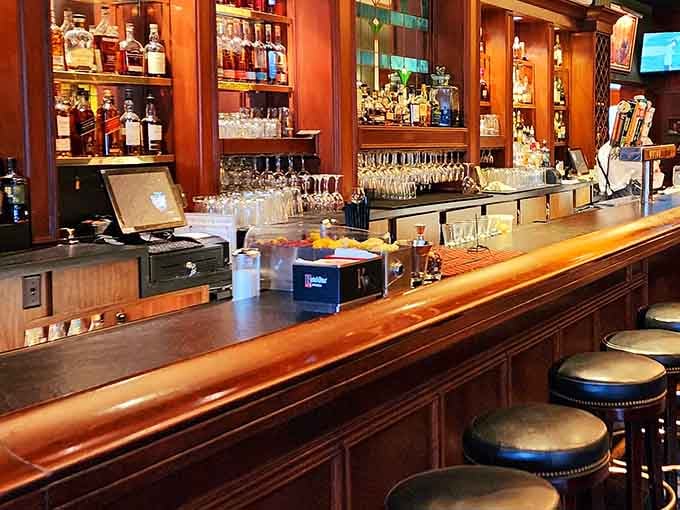 A bar where the wood gleams, the glasses sparkle, and conversations flow as smoothly as the cocktails.