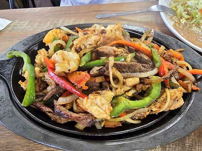Sizzling fajitas arriving at your table with peppers and onions create the kind of entrance everyone notices and envies.