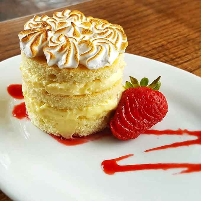 Strawberry shortcake with torched meringue that's almost too pretty to eat, but you absolutely will anyway.