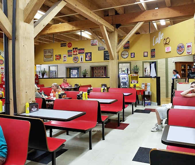 Vintage signs, bright red seating, and exposed beams create an atmosphere where pretzels taste even better than usual.