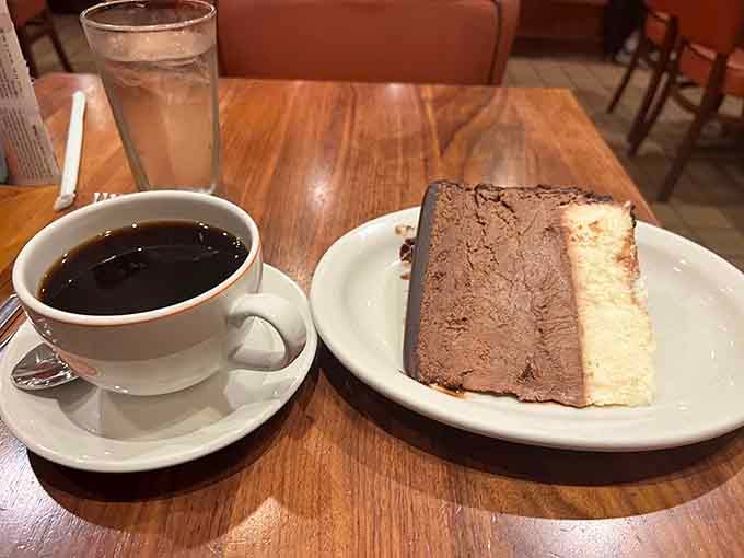 Hot coffee and a slice of chocolate swirl cheesecake, the perfect ending to any meal or day.