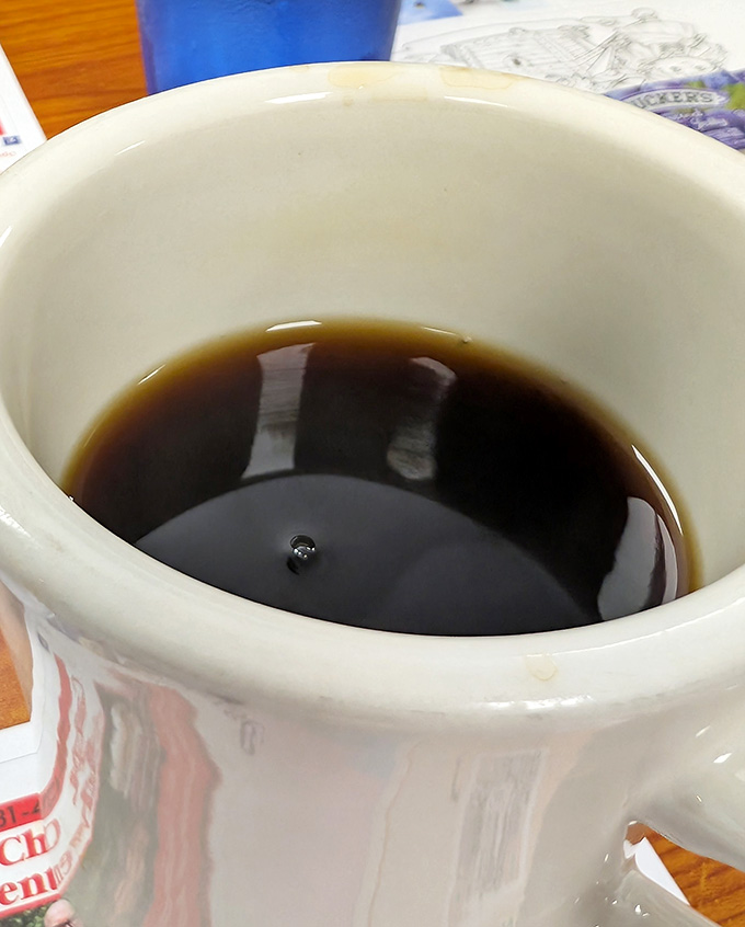 Coffee so dark and inviting, it's like a warm hug in a mug for your morning soul.