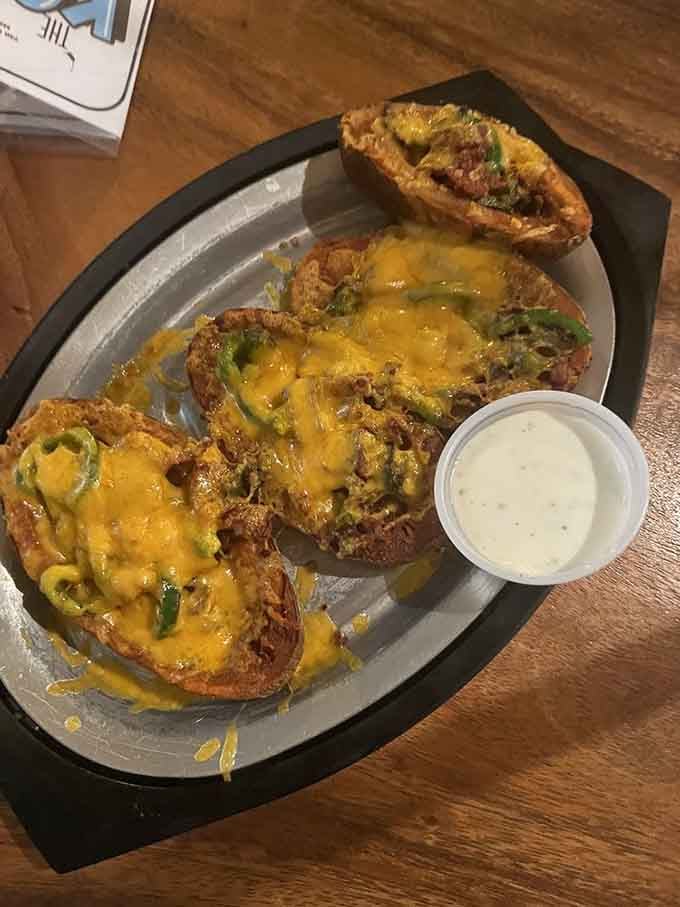 Loaded potato skins with melted cheese and all the fixings make the perfect shareable appetizer, or don't share them.