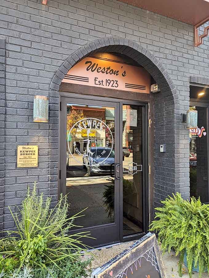 That arched entrance with "Est. 1923" overhead is your portal to nearly a century of burger-flipping excellence and tradition.