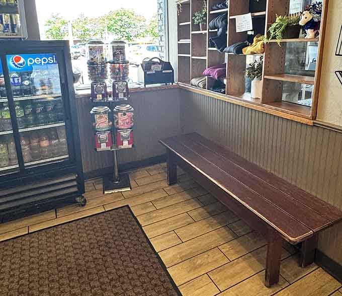 The simple wooden bench by the cooler says "we'll be with you shortly" in the friendliest way possible.