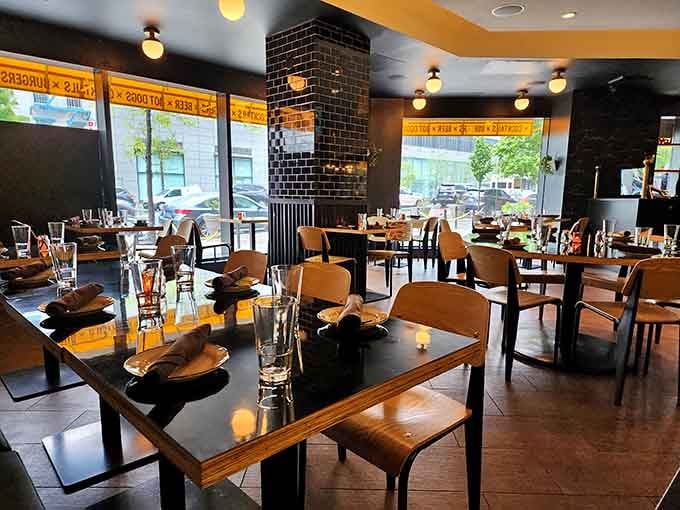 Sunlight streams through windows onto tables set and ready for the kind of meal that requires strategic planning.