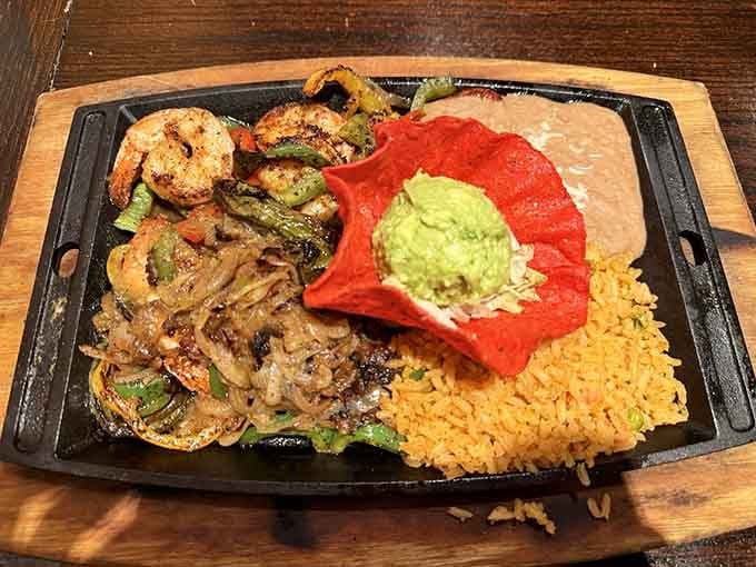 Shrimp fajitas on a sizzling platter with all the fixings&mdash;because sometimes surf beats turf in the desert.